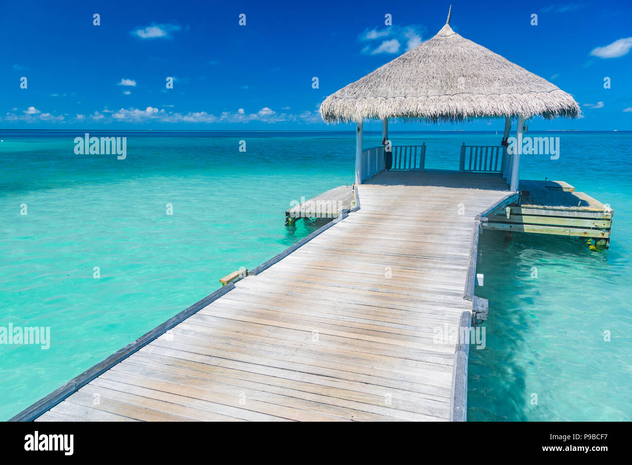 Beautiful beach scene with long wooden jetty. Tranquil and relaxing ...