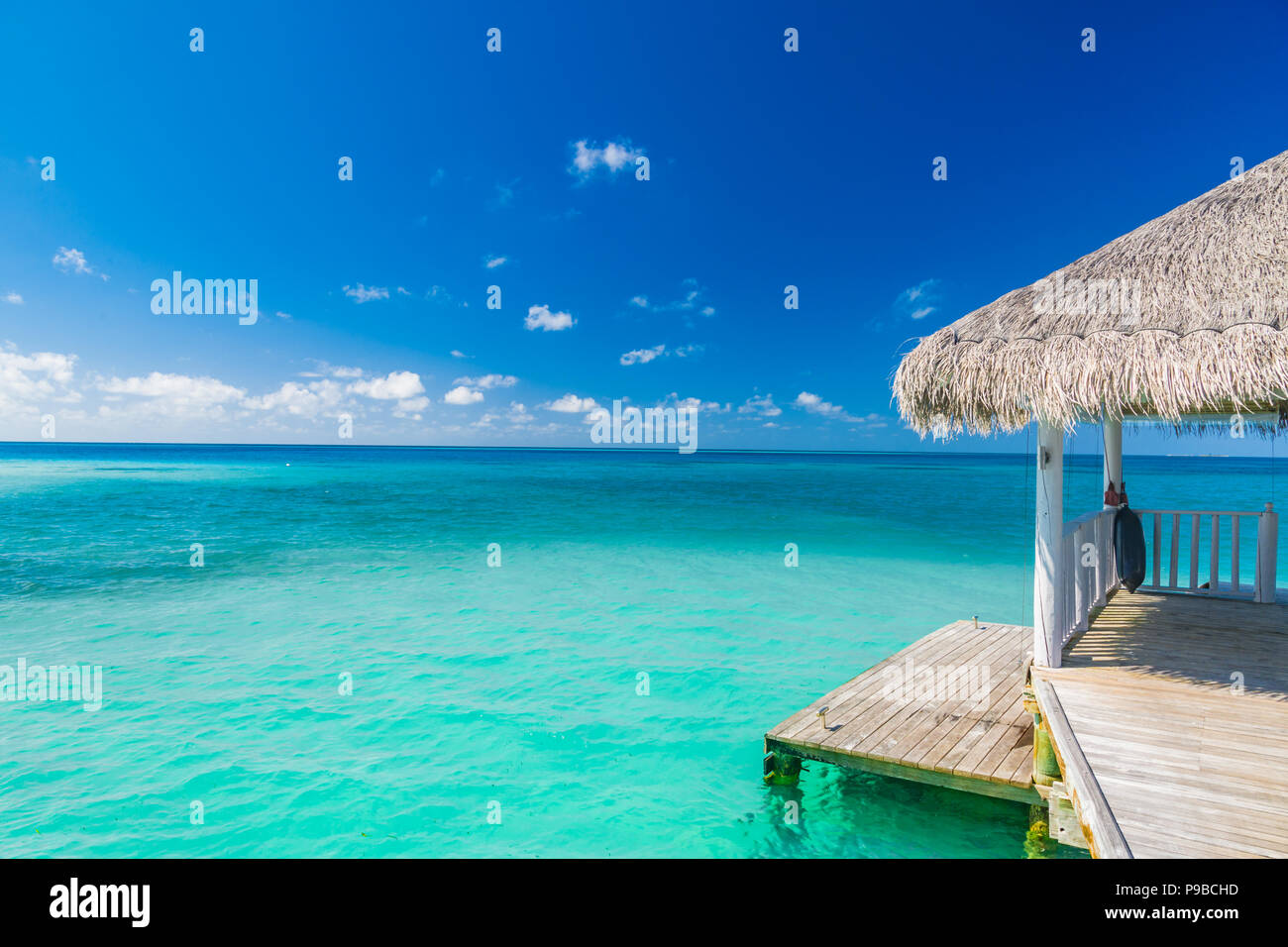 Beautiful beach scene with long wooden jetty. Tranquil and relaxing ...