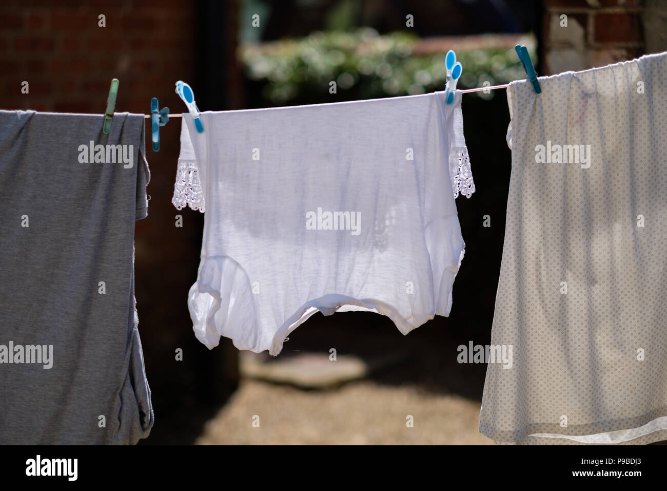 Washing hanging on linen line Stock Photo - Alamy