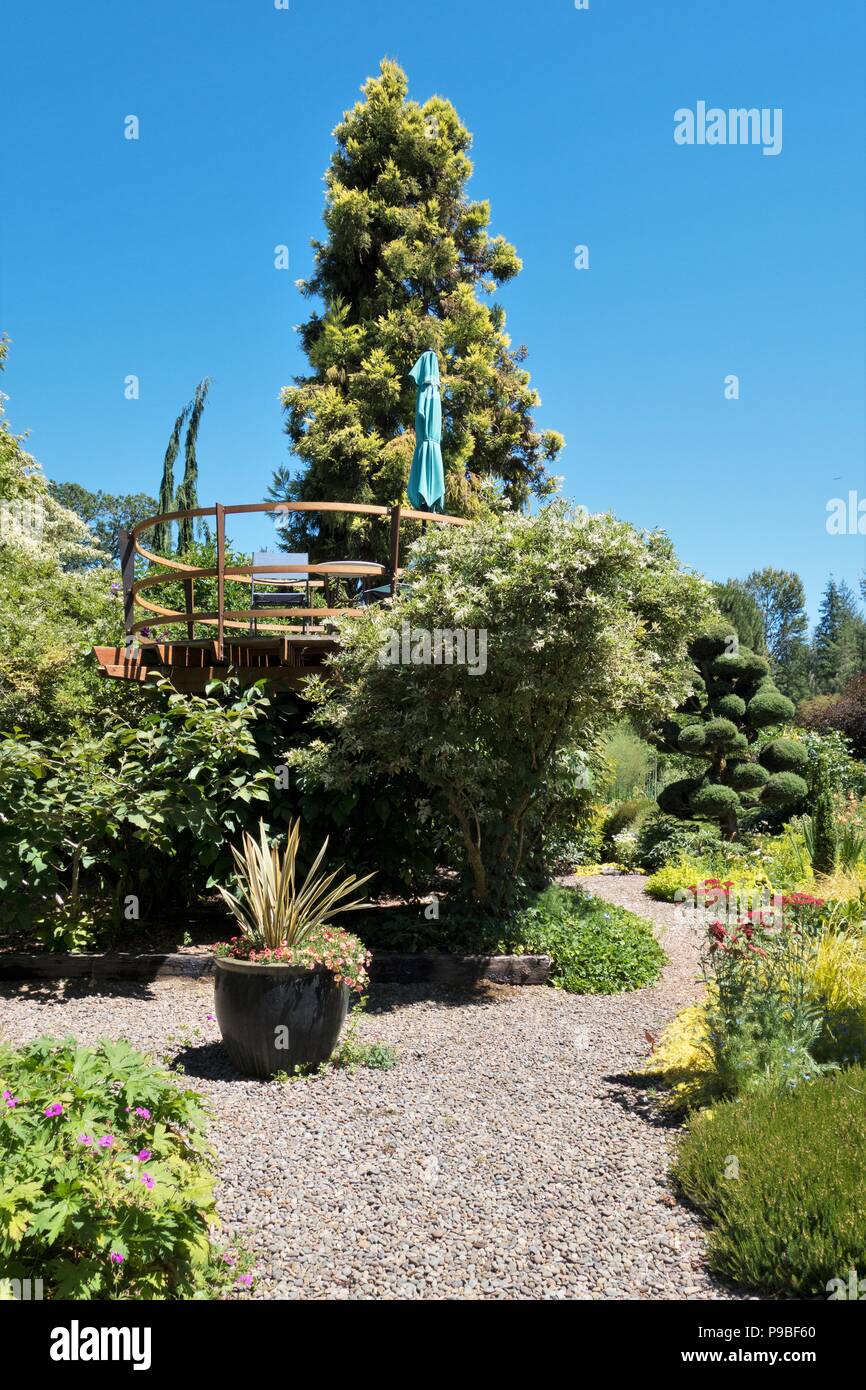 A round, elevated patio area, at a private garden in Eugene, Oregon ...