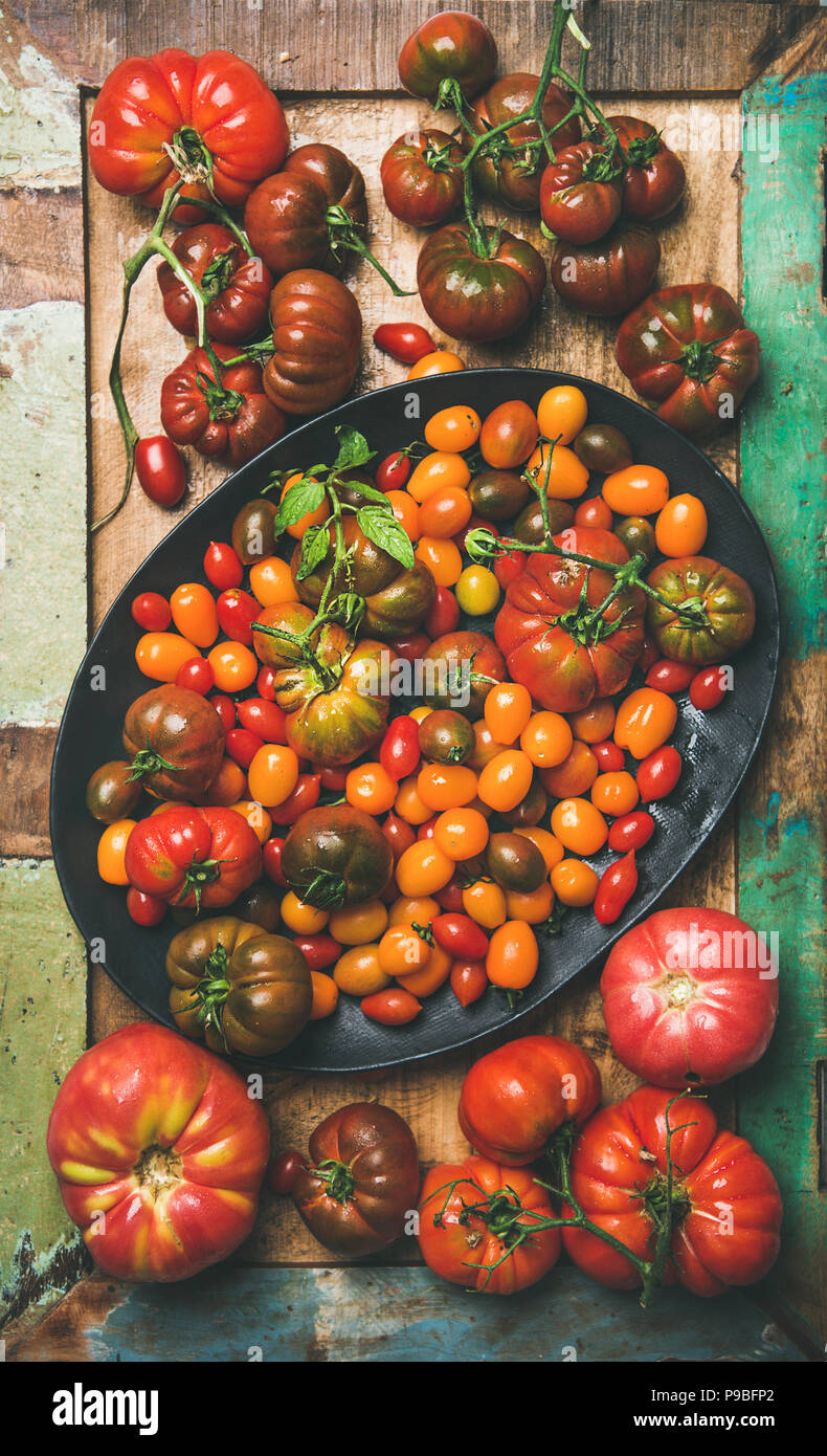 Flat -lay of fresh colorful tomatoes, vertical composition Stock Photo ...