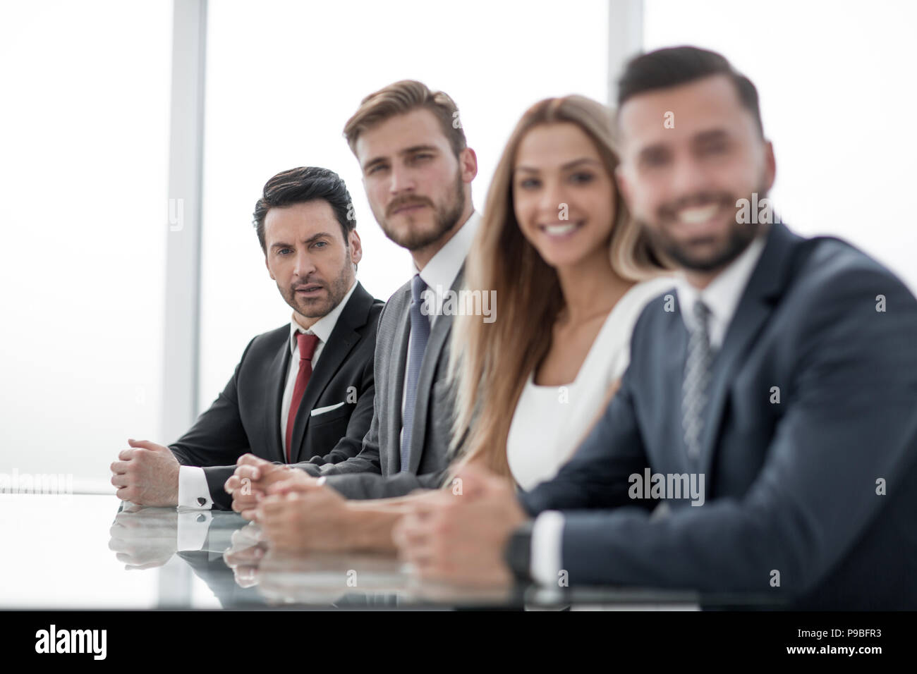 business people sitting at the Desk Stock Photo - Alamy