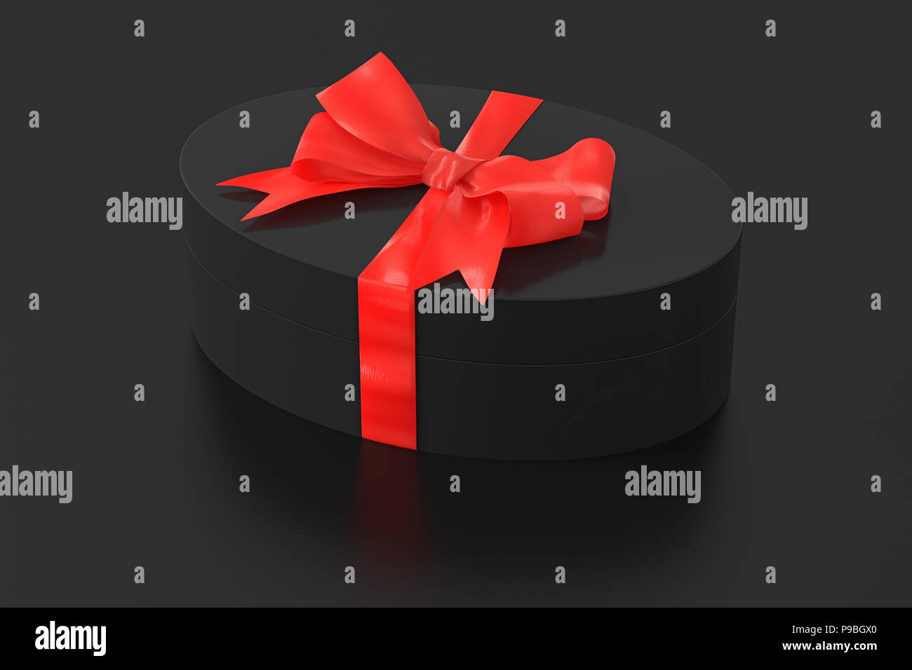 Black oval gift box with red bow on black background with clipping path ...