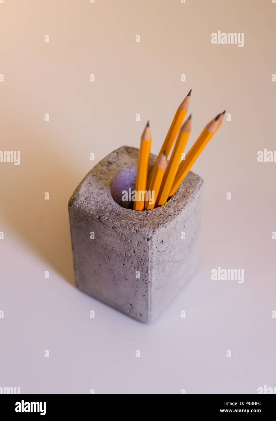 Photograph of some Yellow wood pencils and concrete cube Stock Photo ...