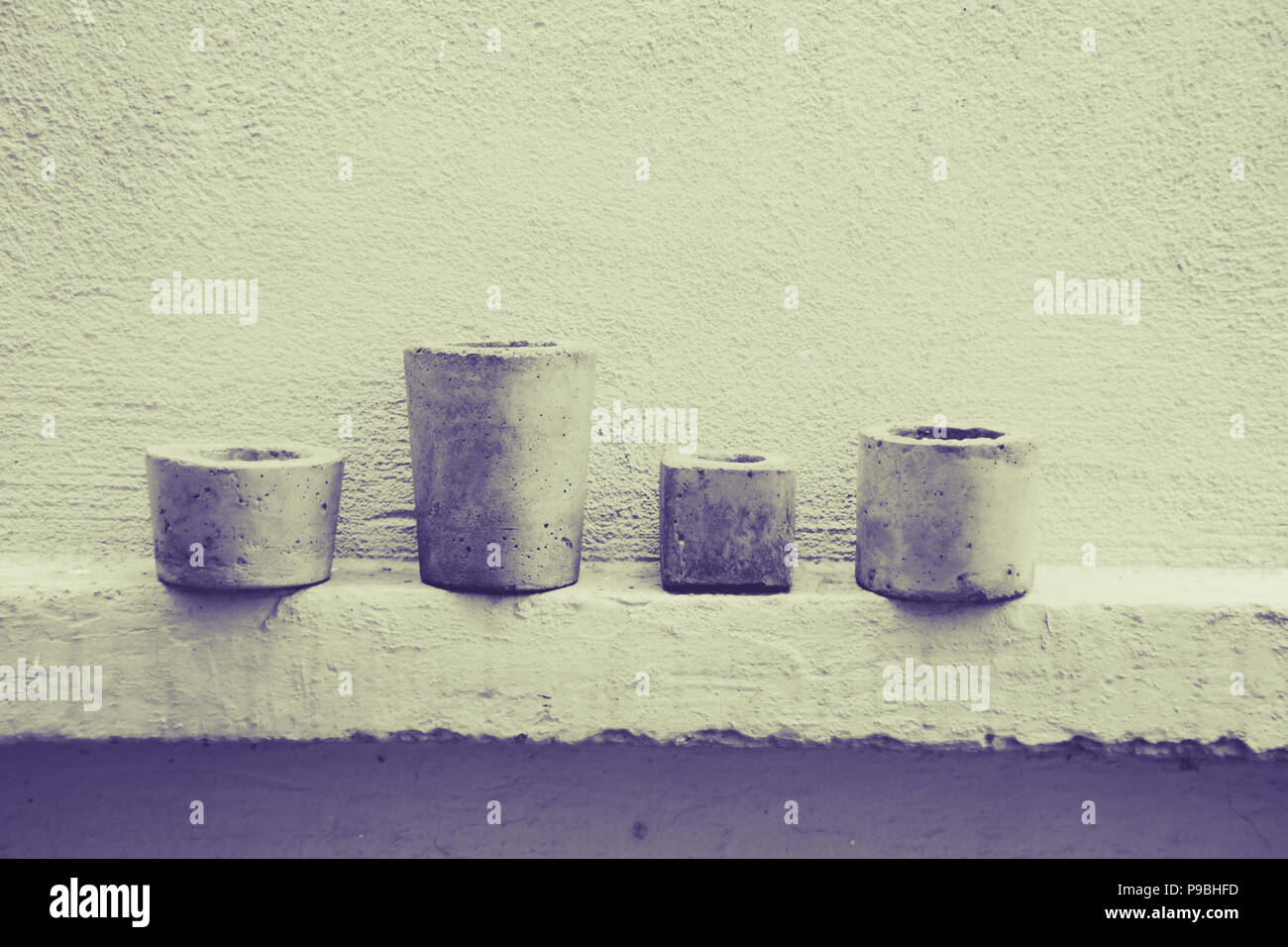 Photograph of some cement or concrete pots Stock Photo - Alamy