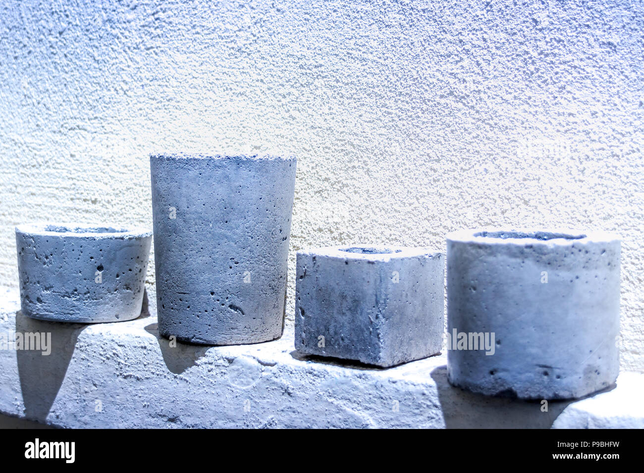 Photograph of some cement or concrete pots Stock Photo - Alamy
