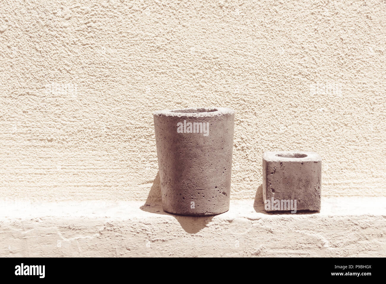 Photograph of some cement or concrete pots Stock Photo - Alamy