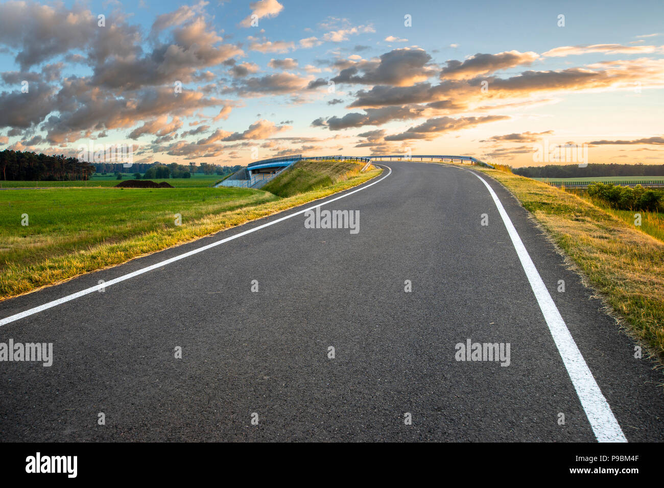 road running over the motorway bridge Stock Photo - Alamy