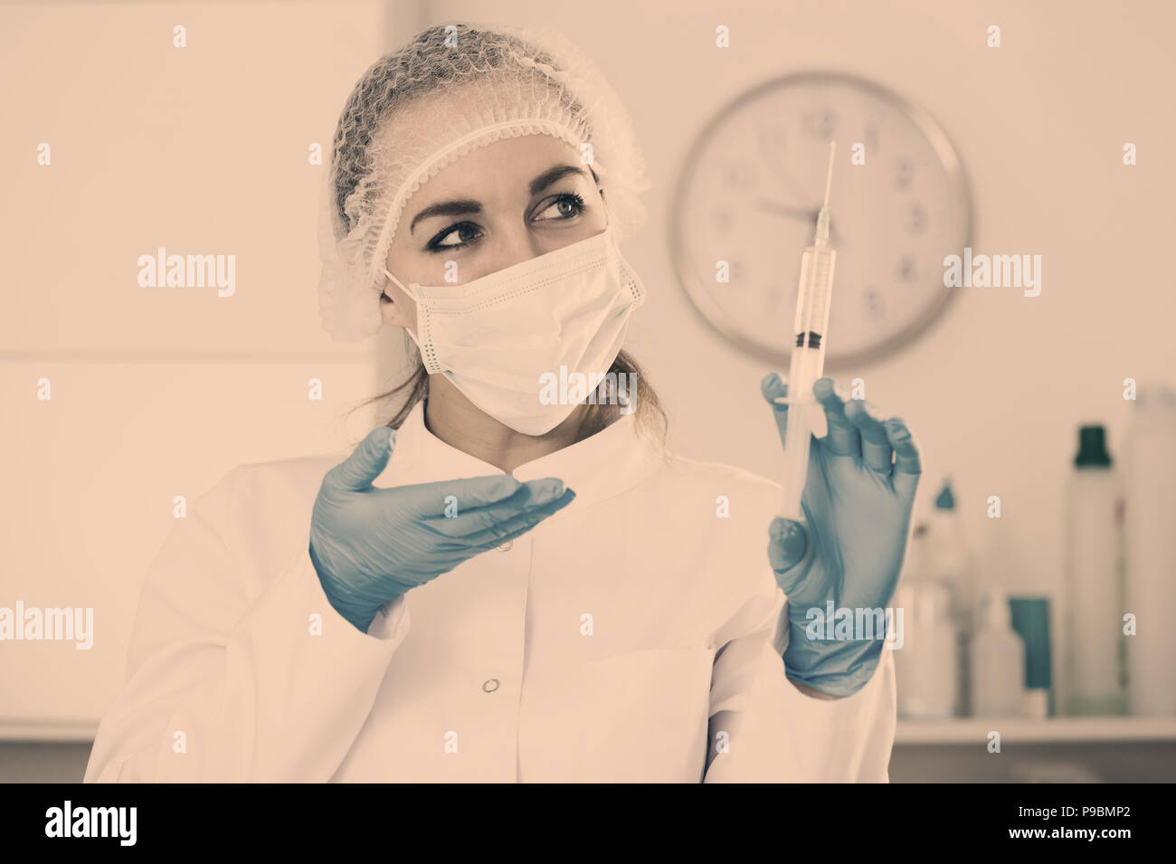Female nurse preparing injection with syringe in hospital Stock Photo ...