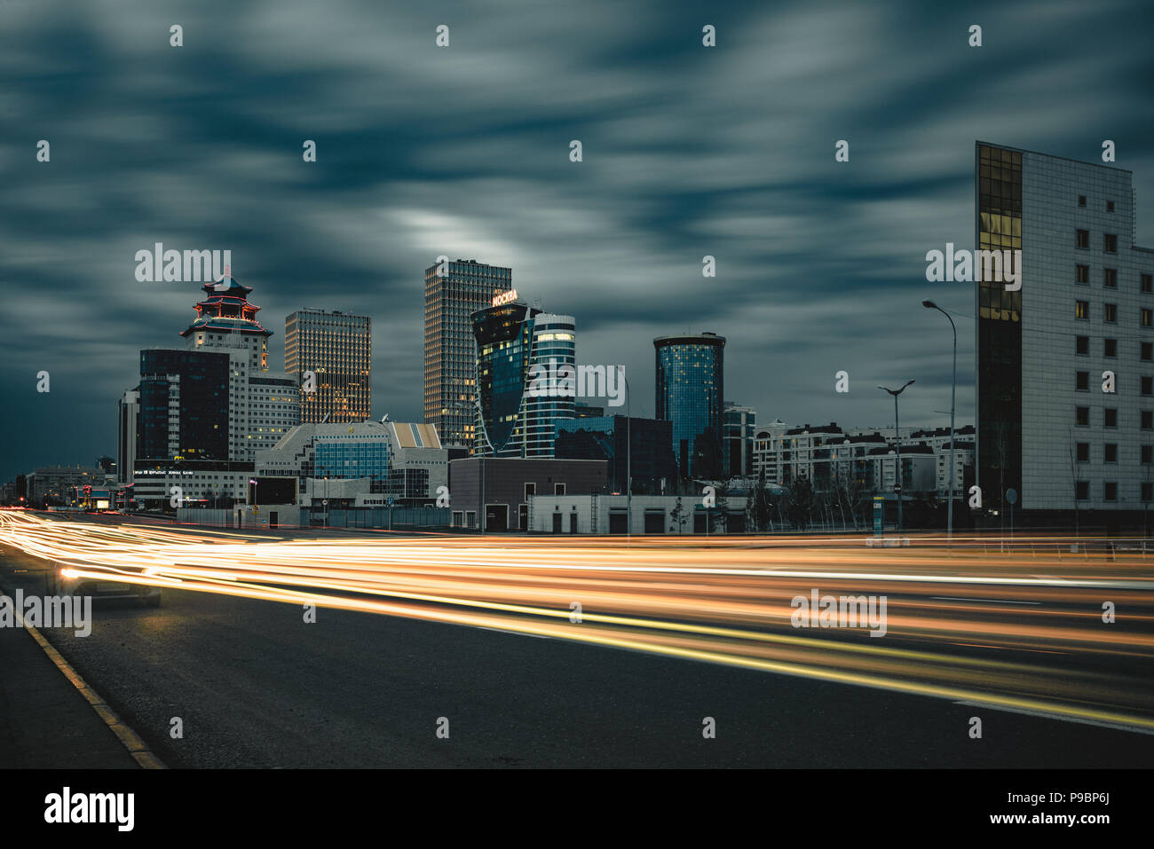 Street night in Astana with view light trails traffic over city ...