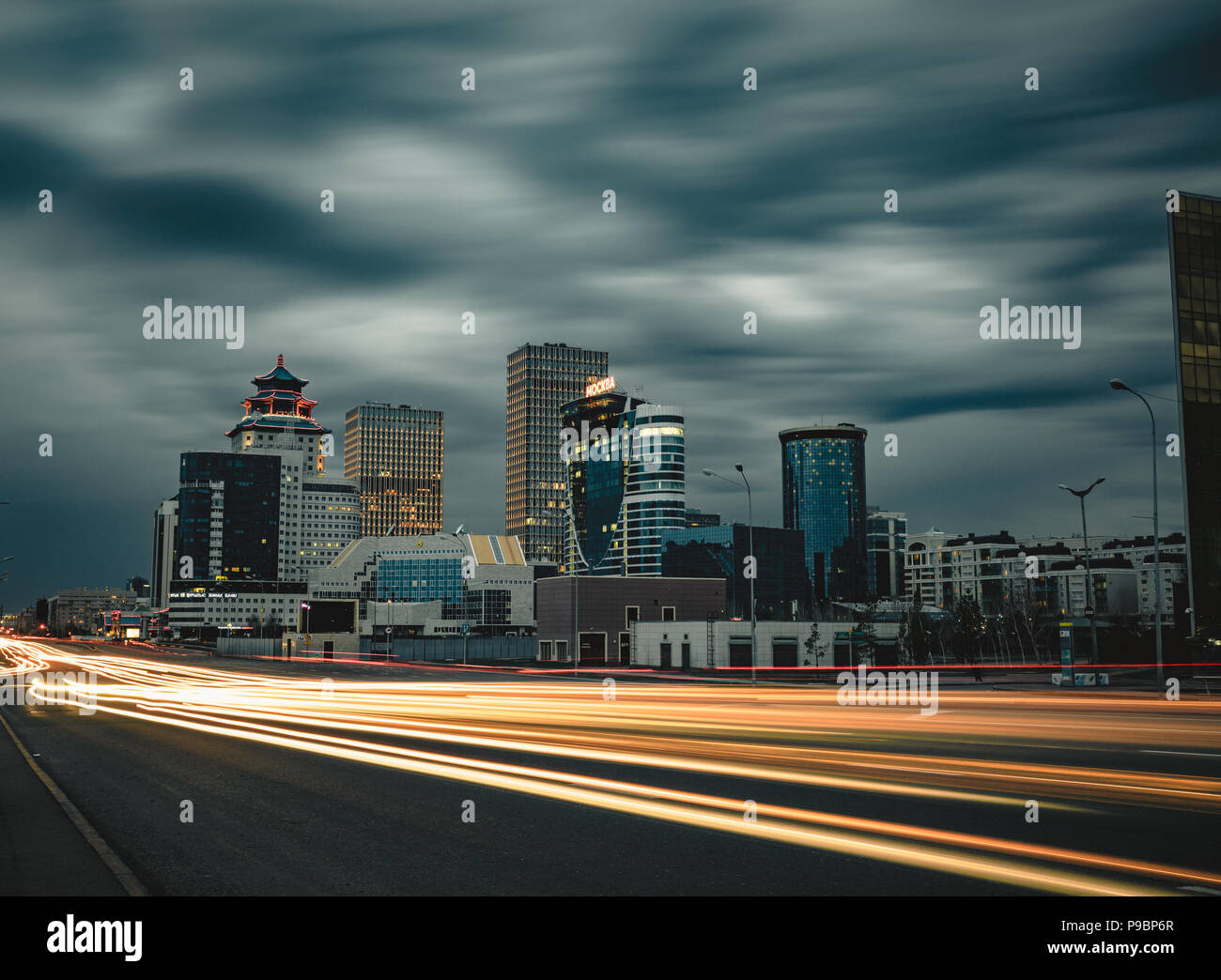 Street night in Astana with view light trails traffic over city ...