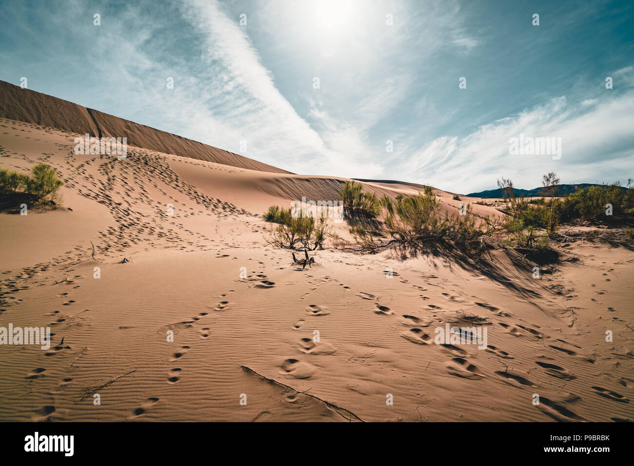 Sand dunes under blue sky. Sahara Desert, Previously, village houses ...