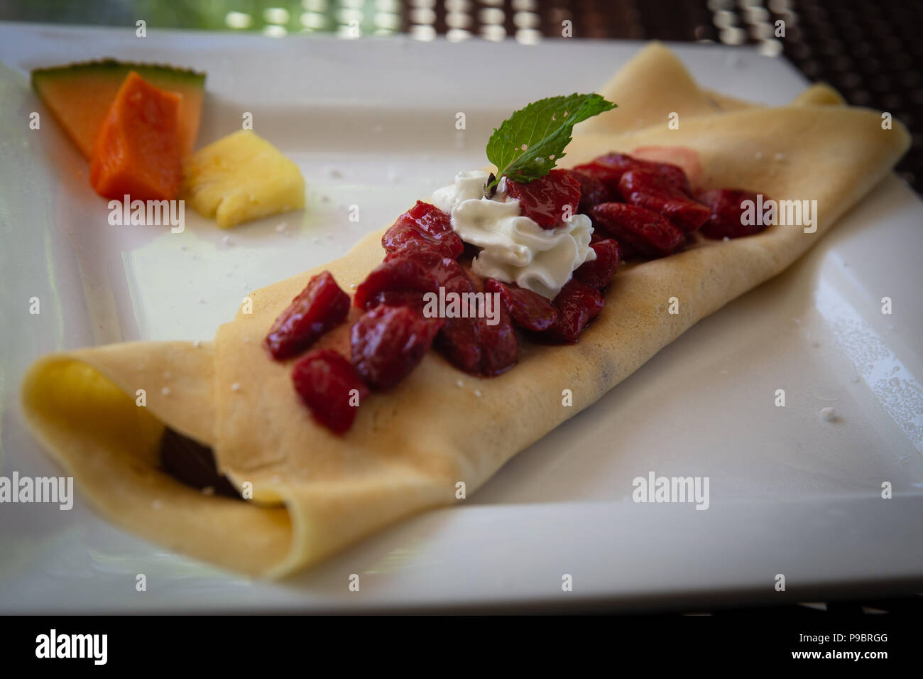 Strawberry Crepe with Chocolate Filling topped with whip cream Stock ...