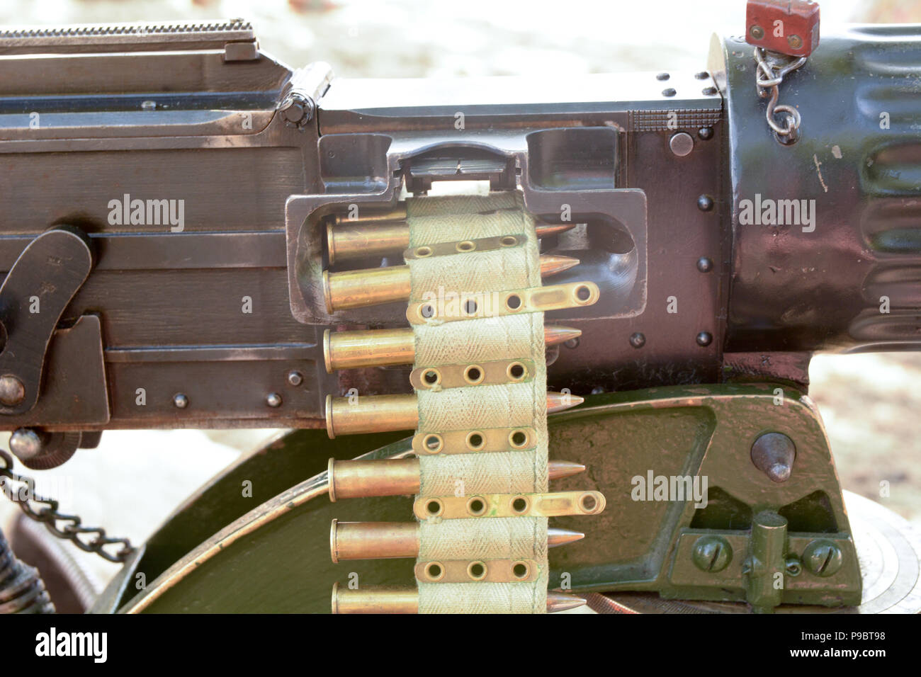 .303 calibre bullets on belt being fed into Vickers heavy machine gun ...