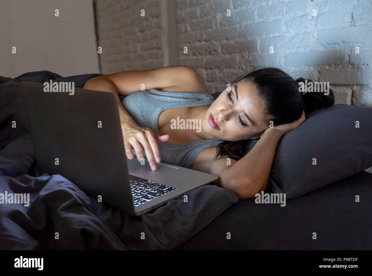 beautiful latin internet addicted woman working and surfing on her ...