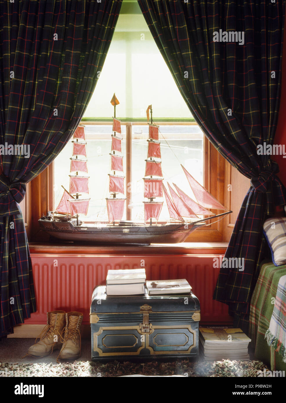 Tartan curtains on window with model sailing ship on windowsill Stock ...