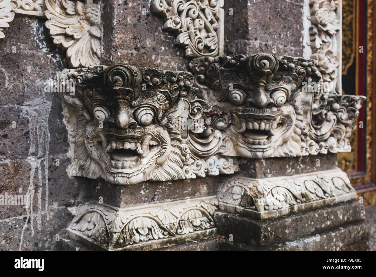 Traditional balinese stone carving, wall in temple Stock Photo - Alamy