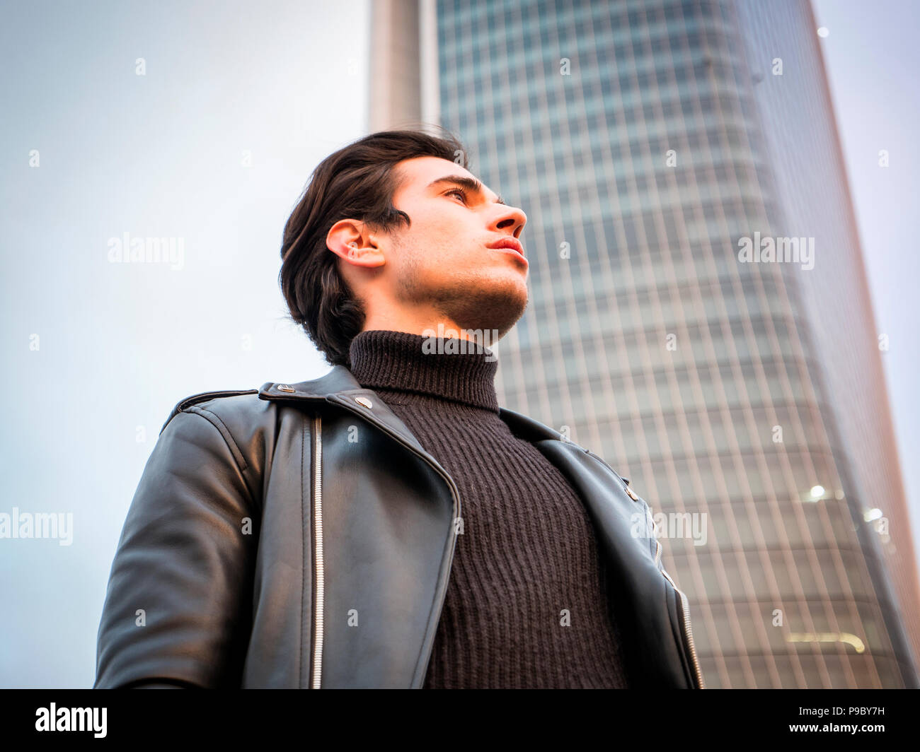 One handsome young man in modern city setting Stock Photo - Alamy