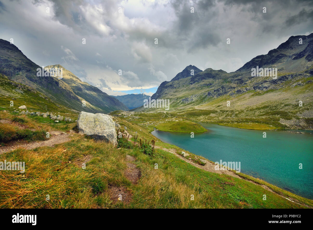 Beautiful view of the emerald alpine lake. Dramatic and picturesque ...