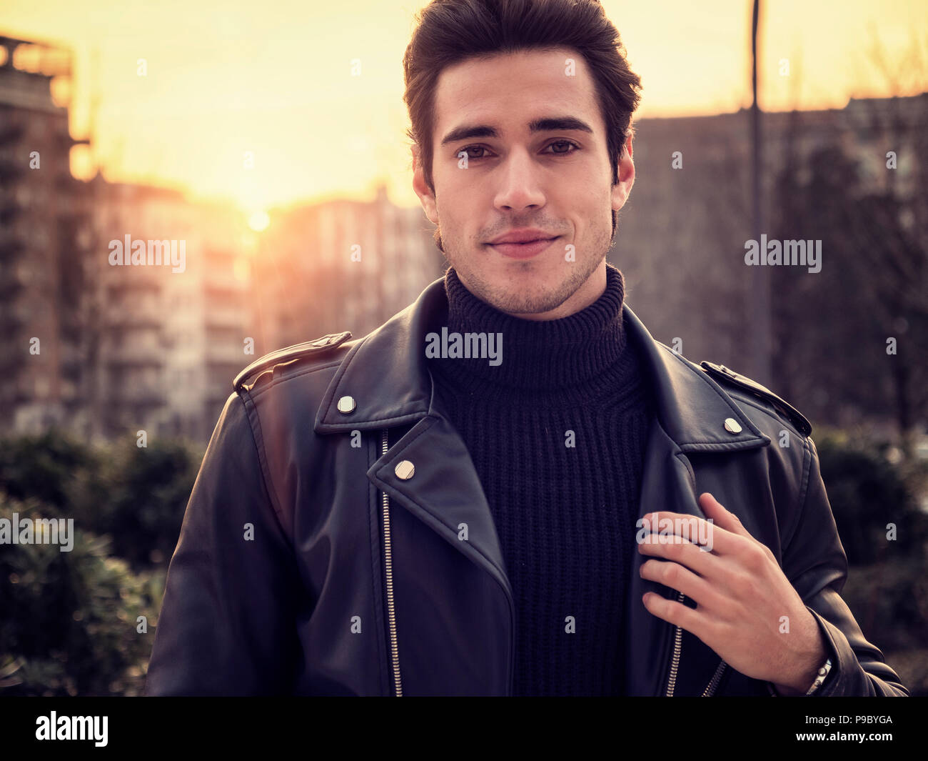 One handsome young man in modern city setting Stock Photo - Alamy
