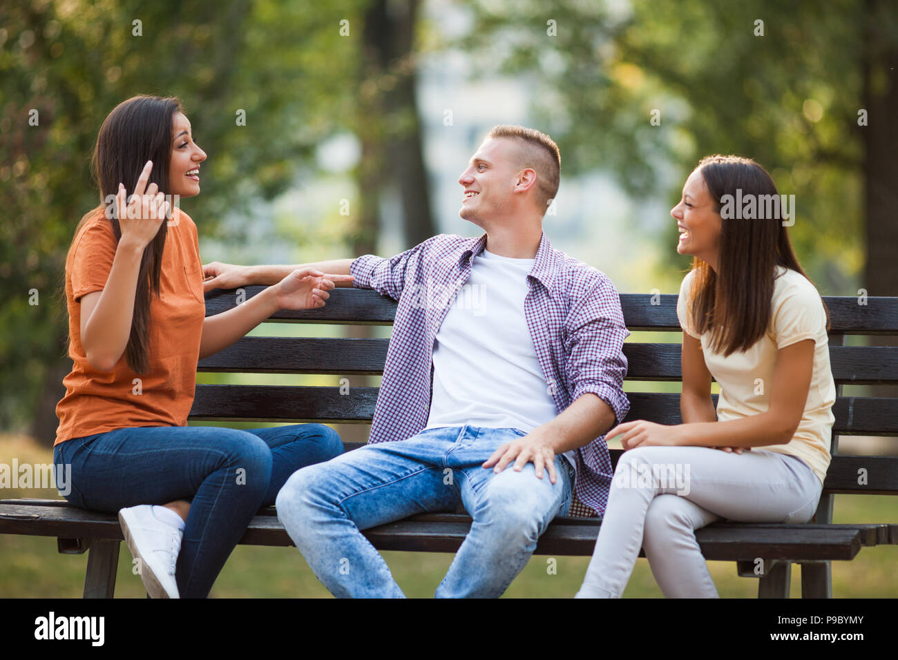People Sitting On A Park Bench