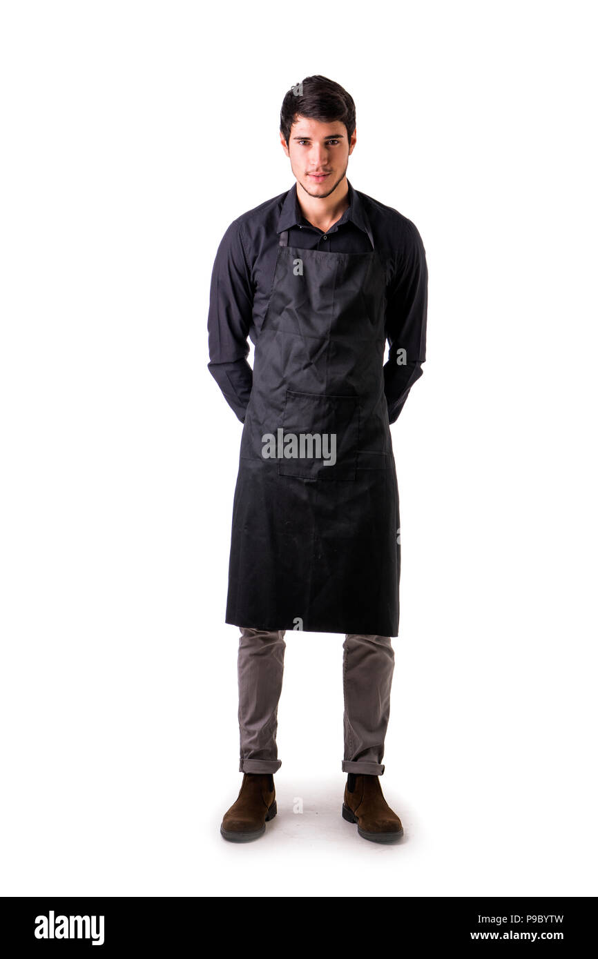 Young chef or waiter wearing black apron isolated Stock Photo - Alamy