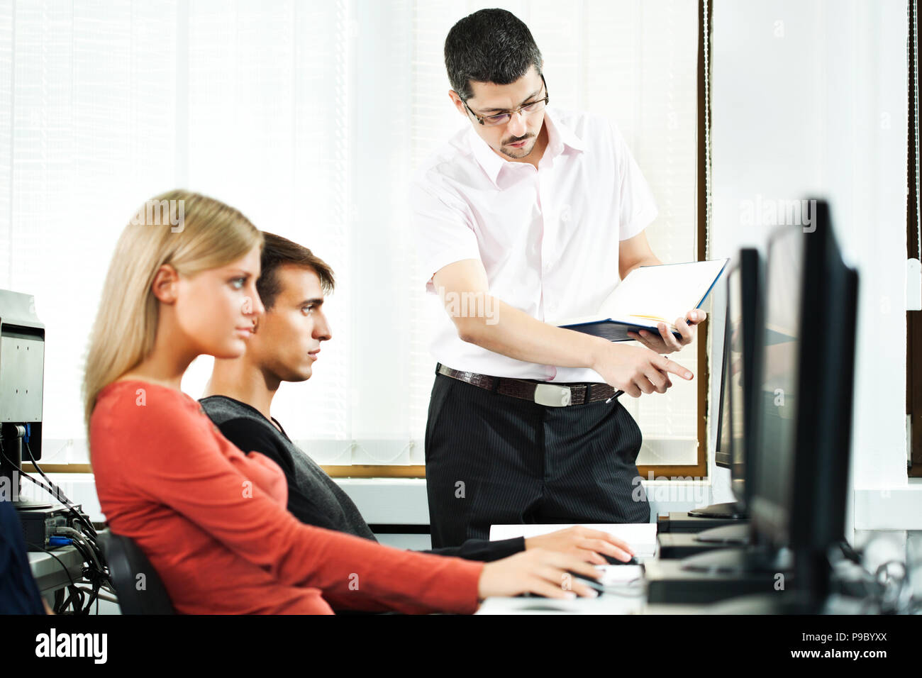 Students learning in computer lab Stock Photo - Alamy