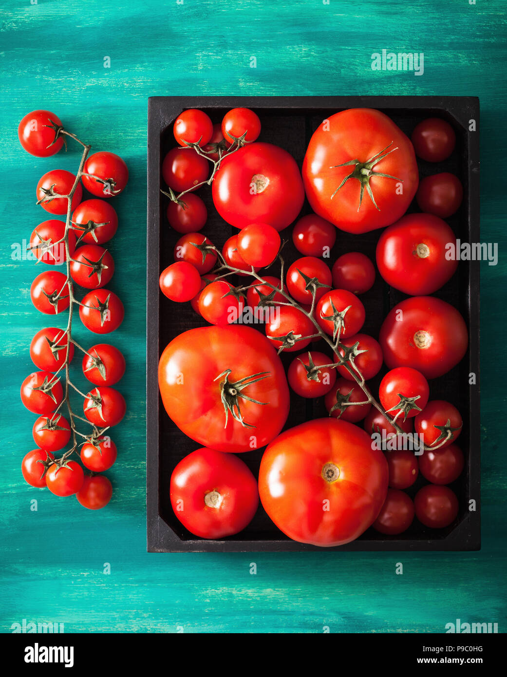 assorted tomatoes in wooden box Stock Photo - Alamy