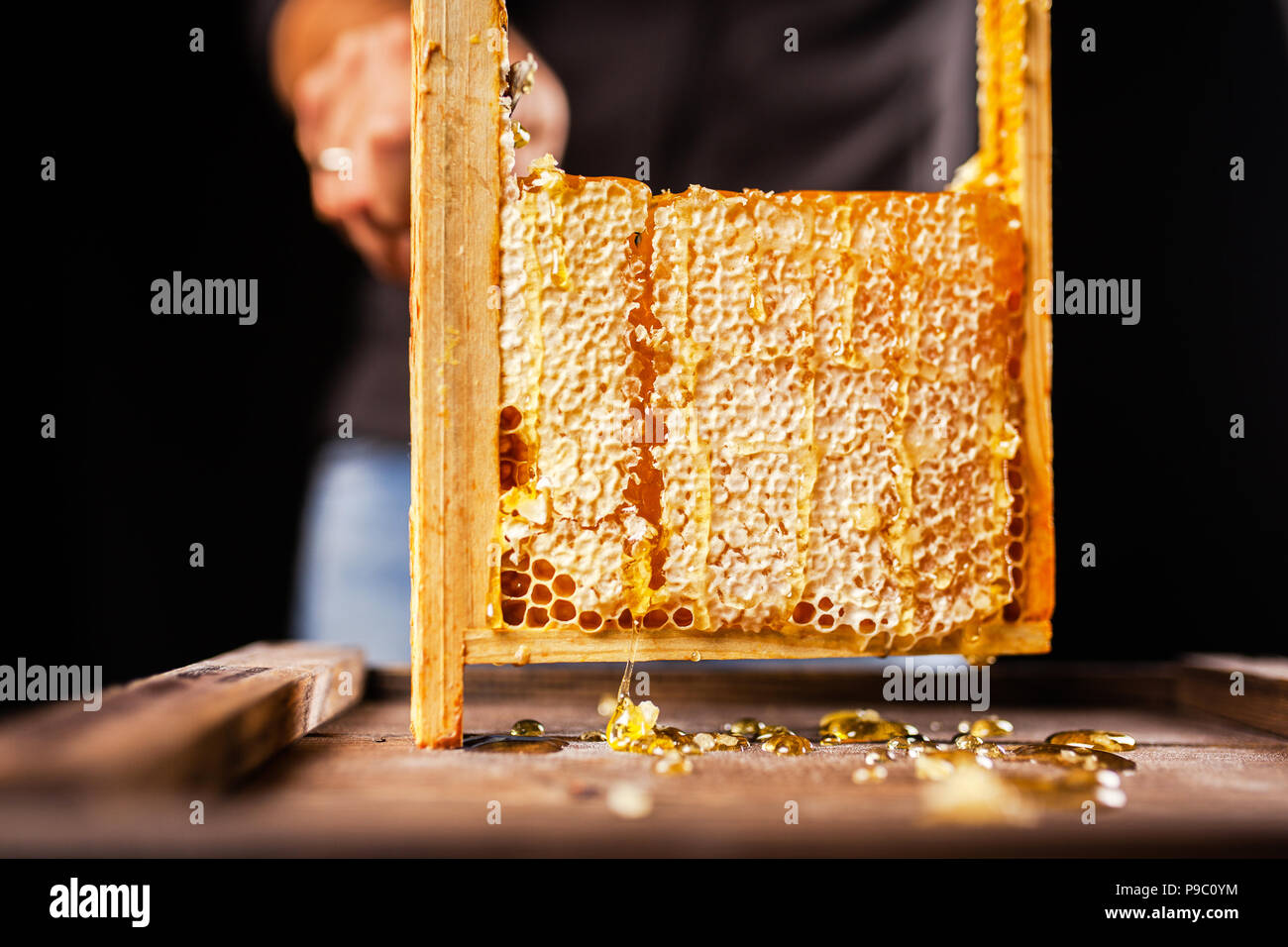 Honeycomb in a wooden frame Stock Photo - Alamy