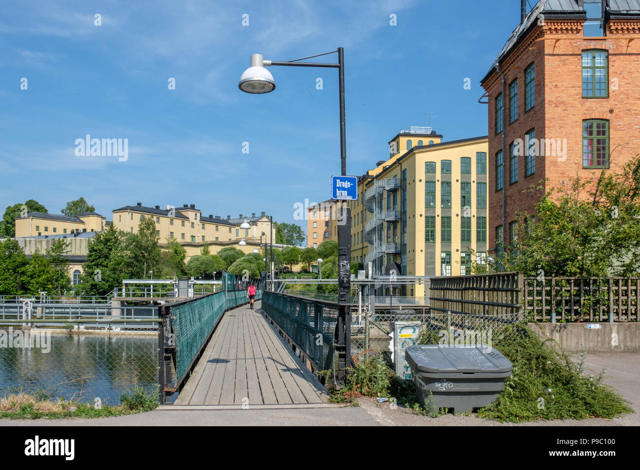 Motala river and the industrial landscape during summer in Norrkoping ...