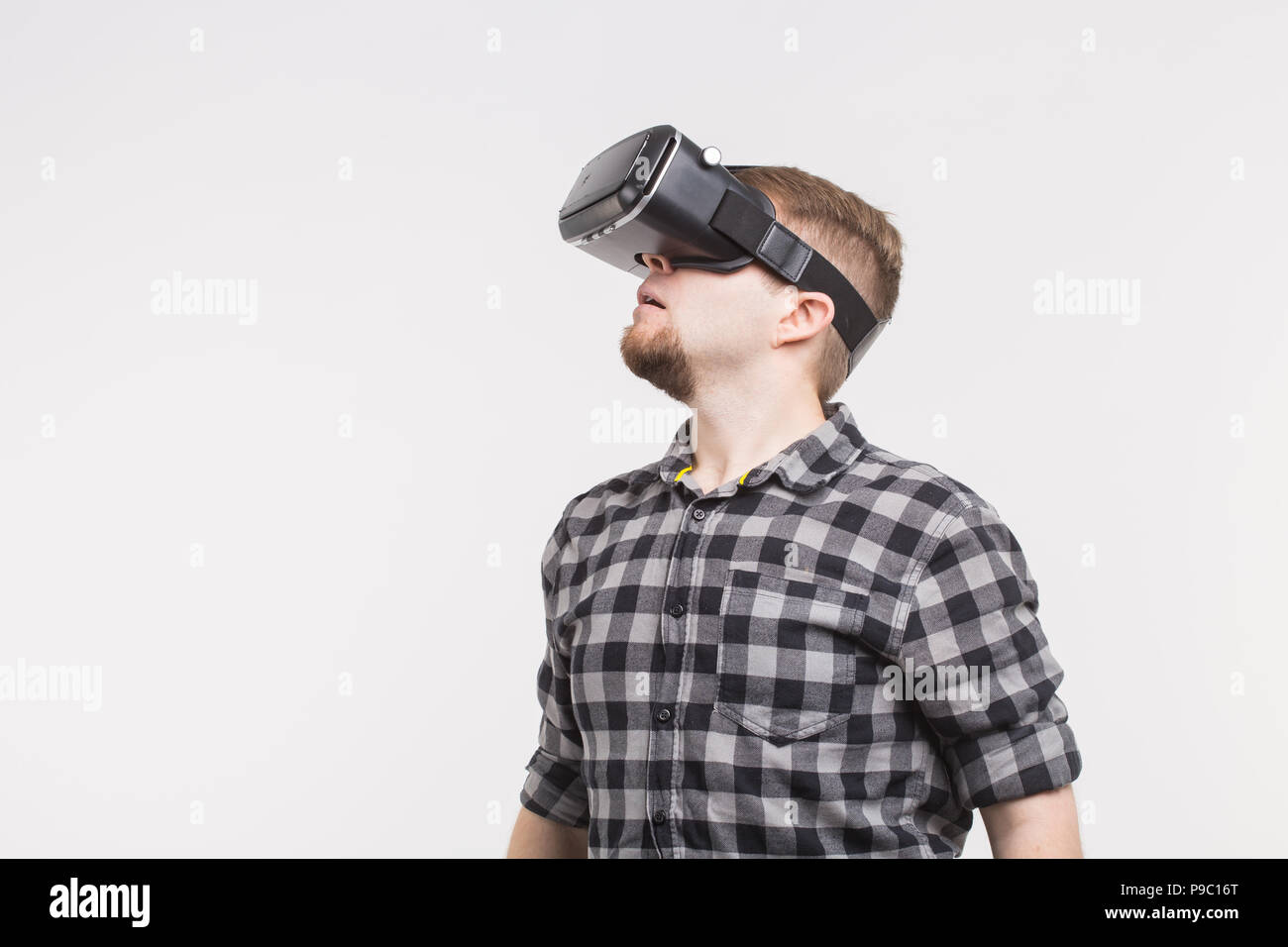 Side view of white men wearing vr glasses Stock Photo - Alamy