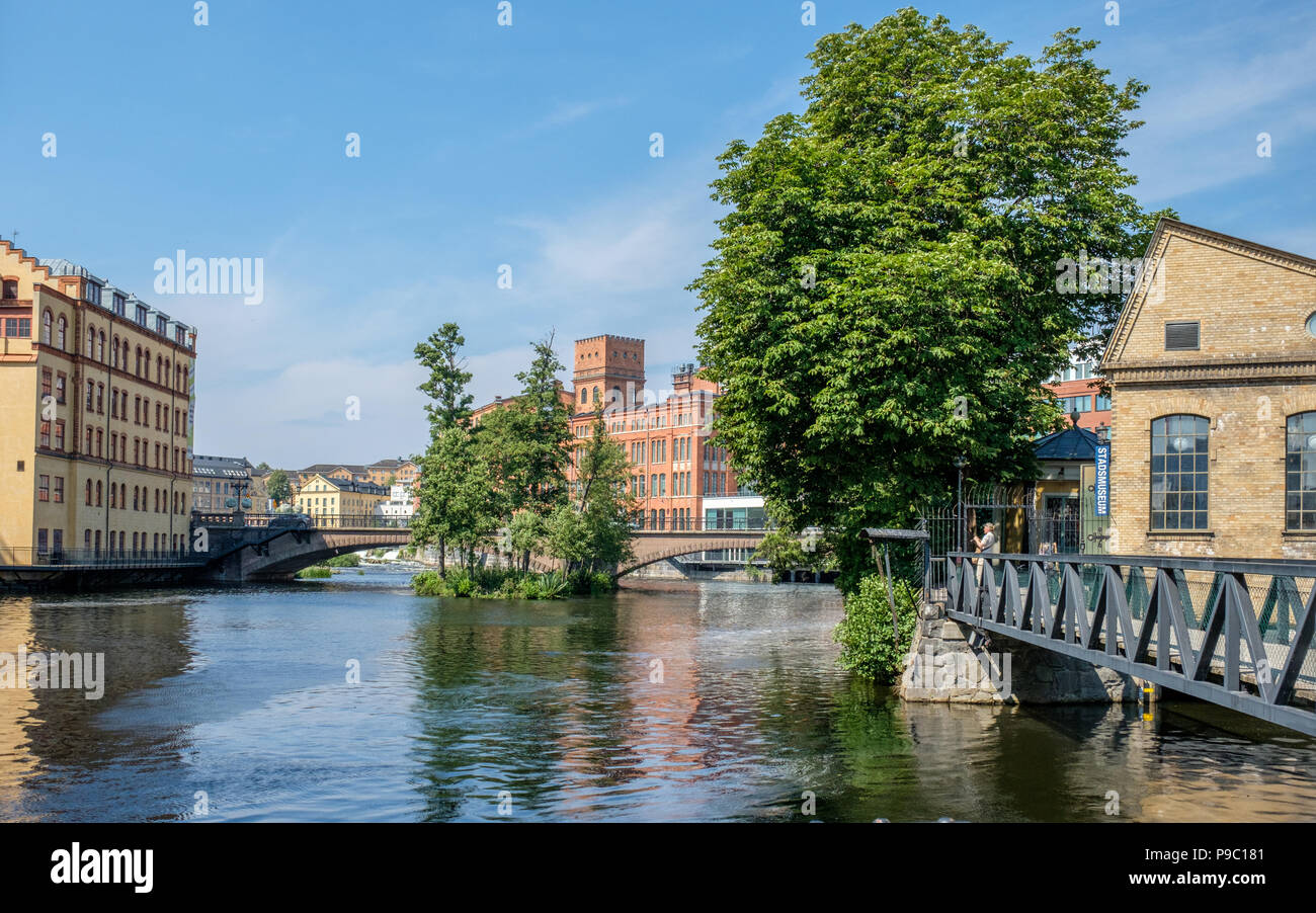 Motala river and the industrial landscape during summer in Norrkoping ...