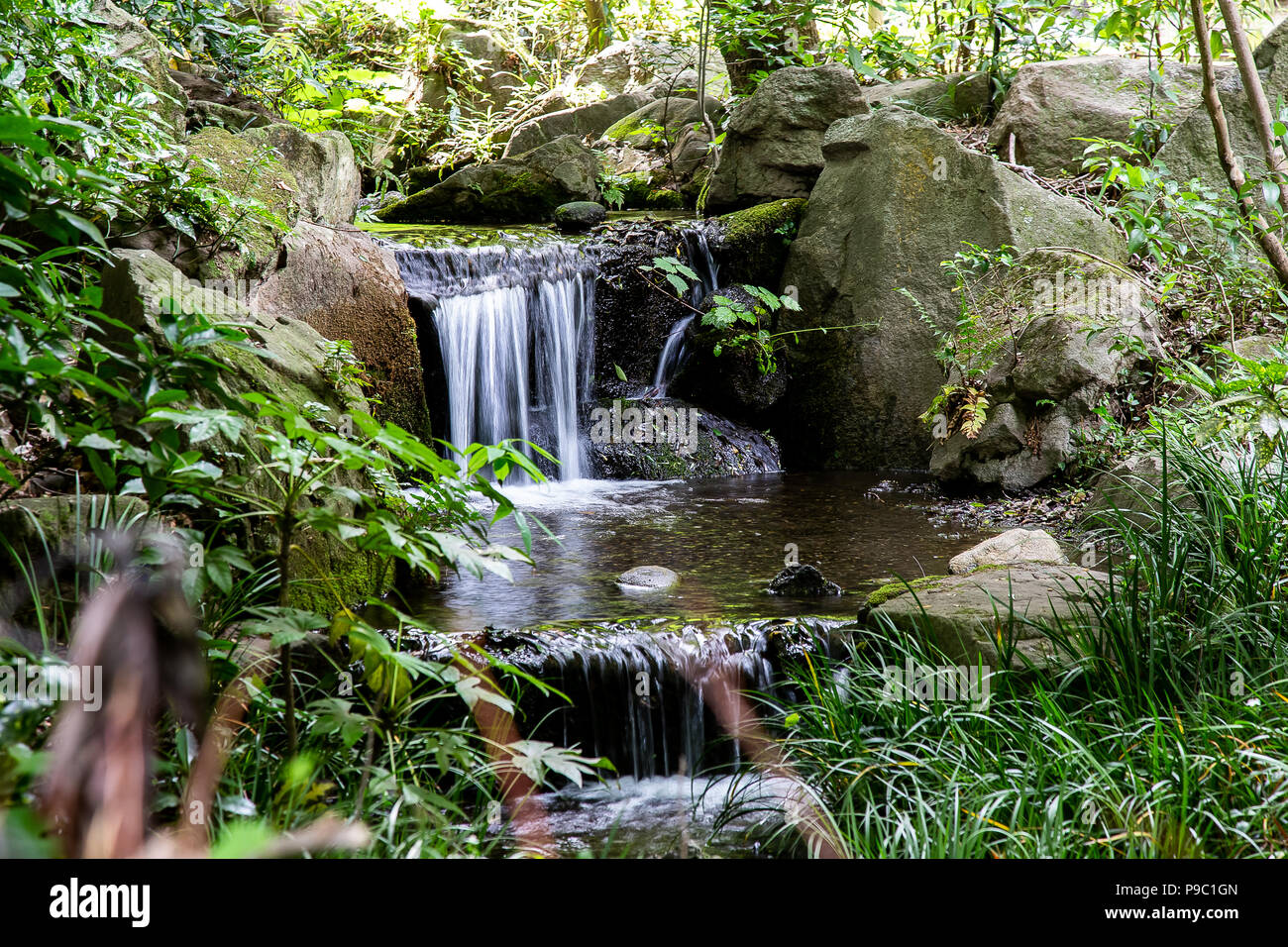 A small waterfall in a park garden in Yamato, Japan Stock Photo - Alamy