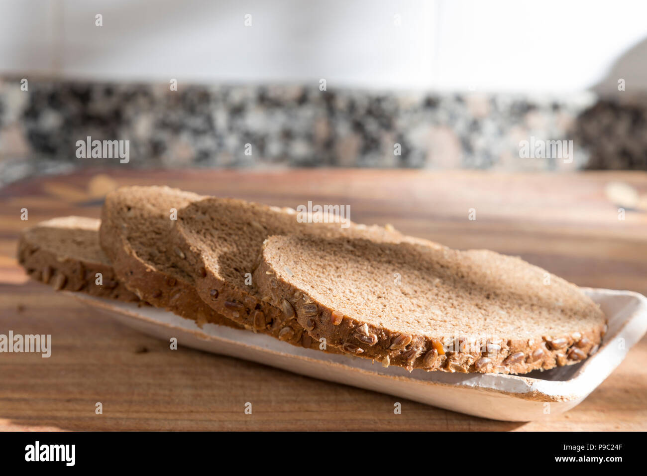 tray with several slices of wholemeal rye bread with pipes prepared for ...