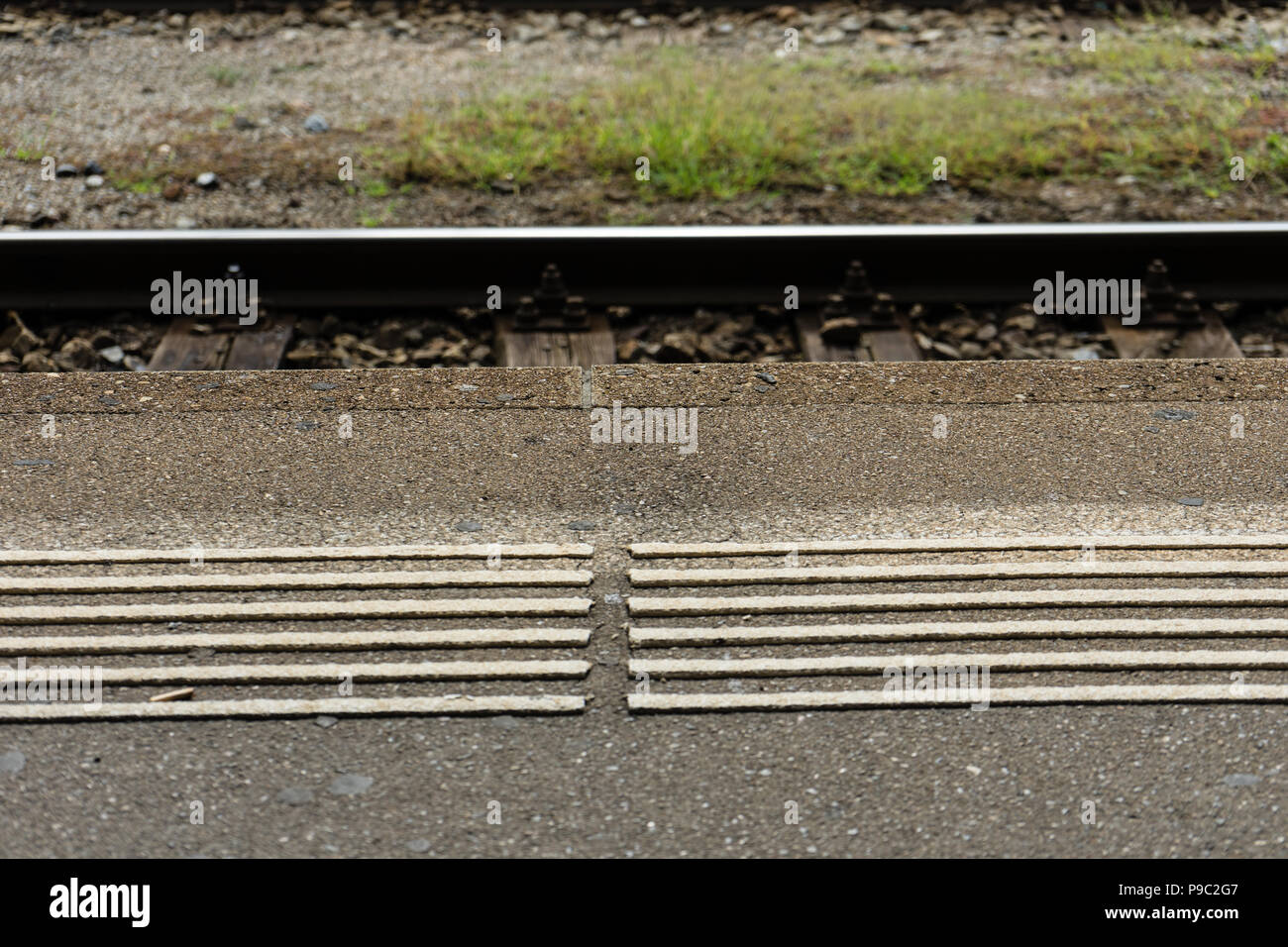 railway station train track white blind people markings Stock Photo - Alamy