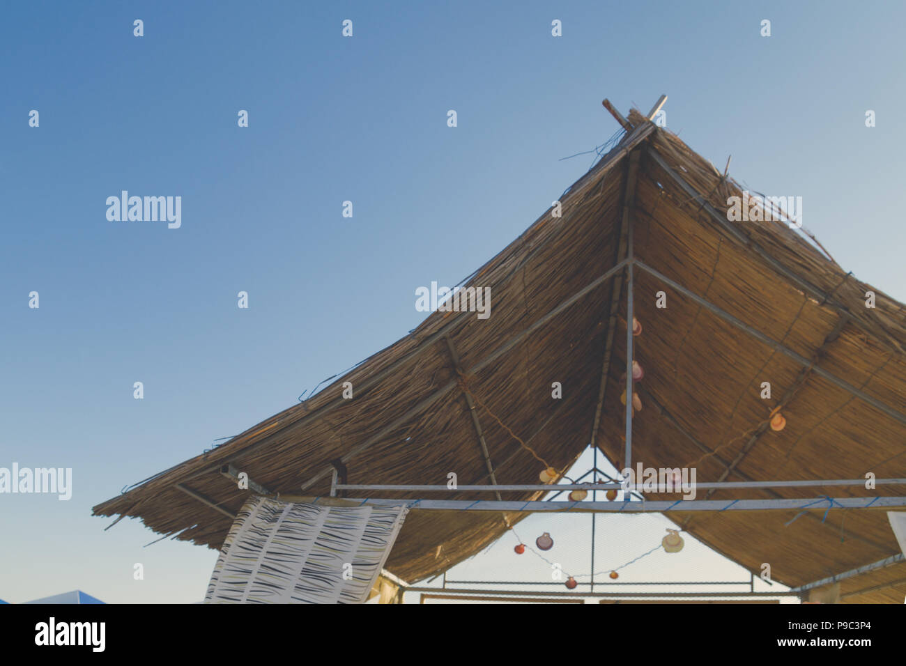 Wooden beach house decorated with sea shells on the beach Stock Photo ...