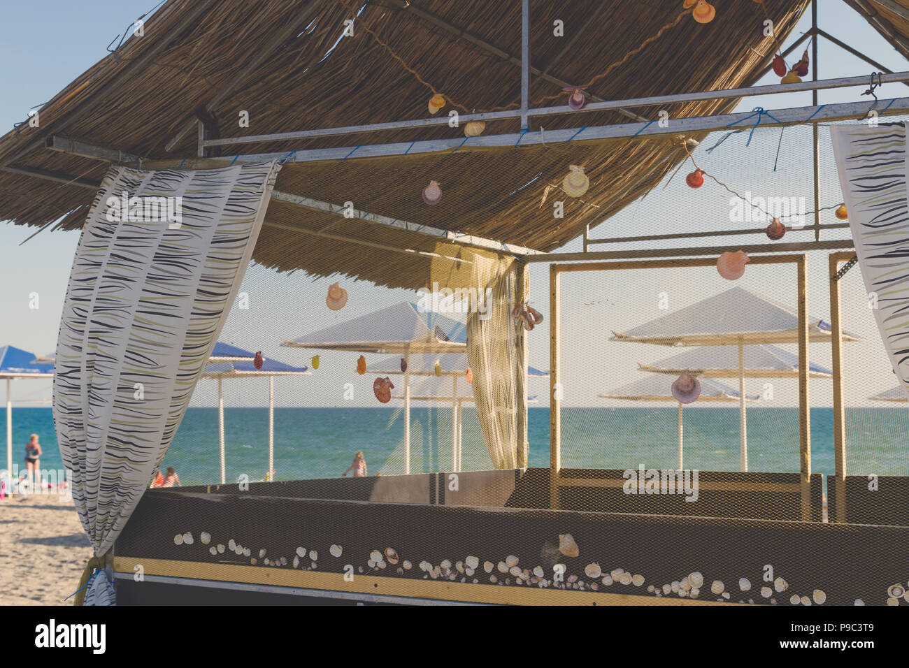 Wooden beach house decorated with sea shells on the beach Stock Photo ...