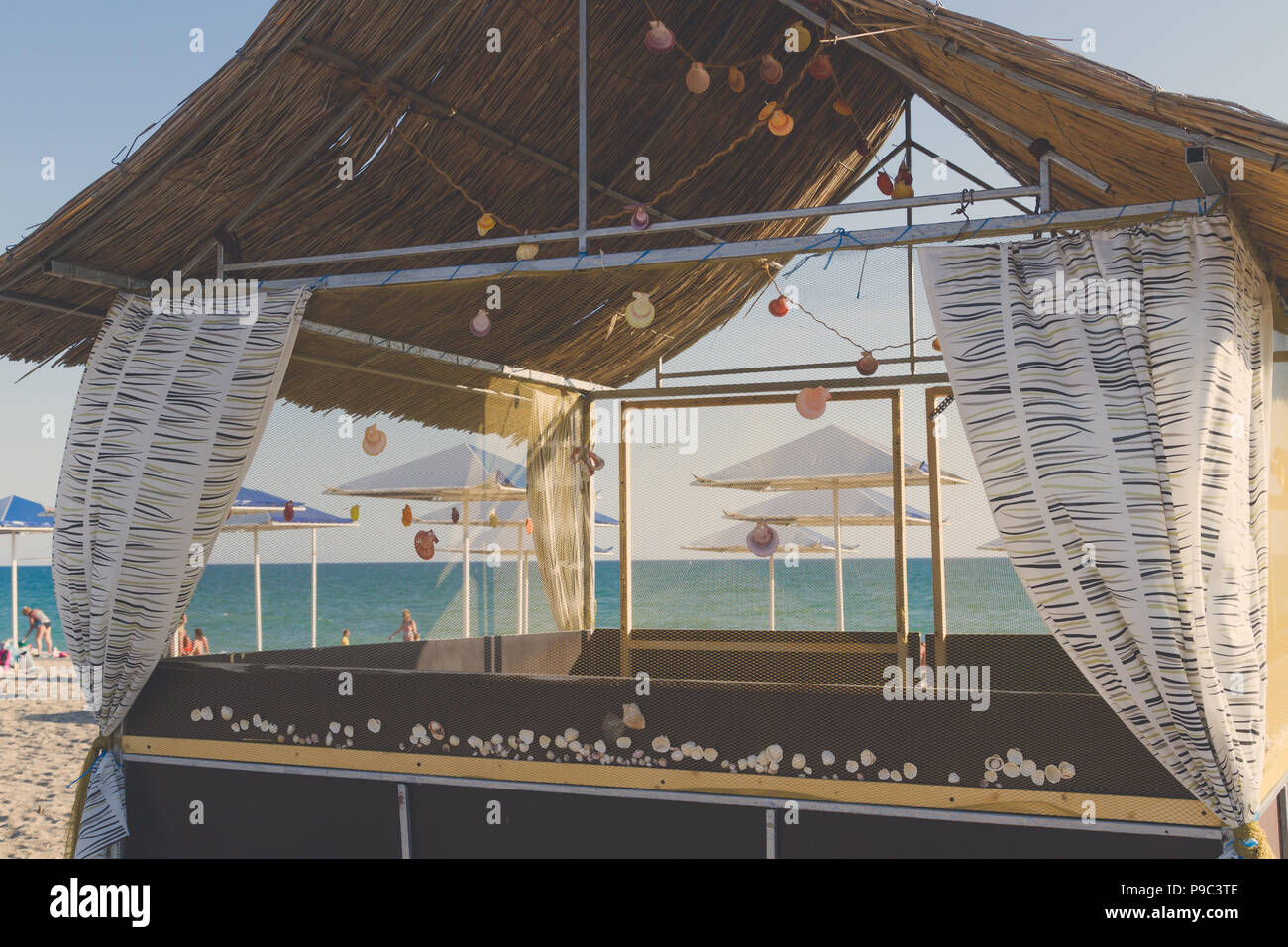 Wooden beach house decorated with sea shells on the beach Stock Photo ...