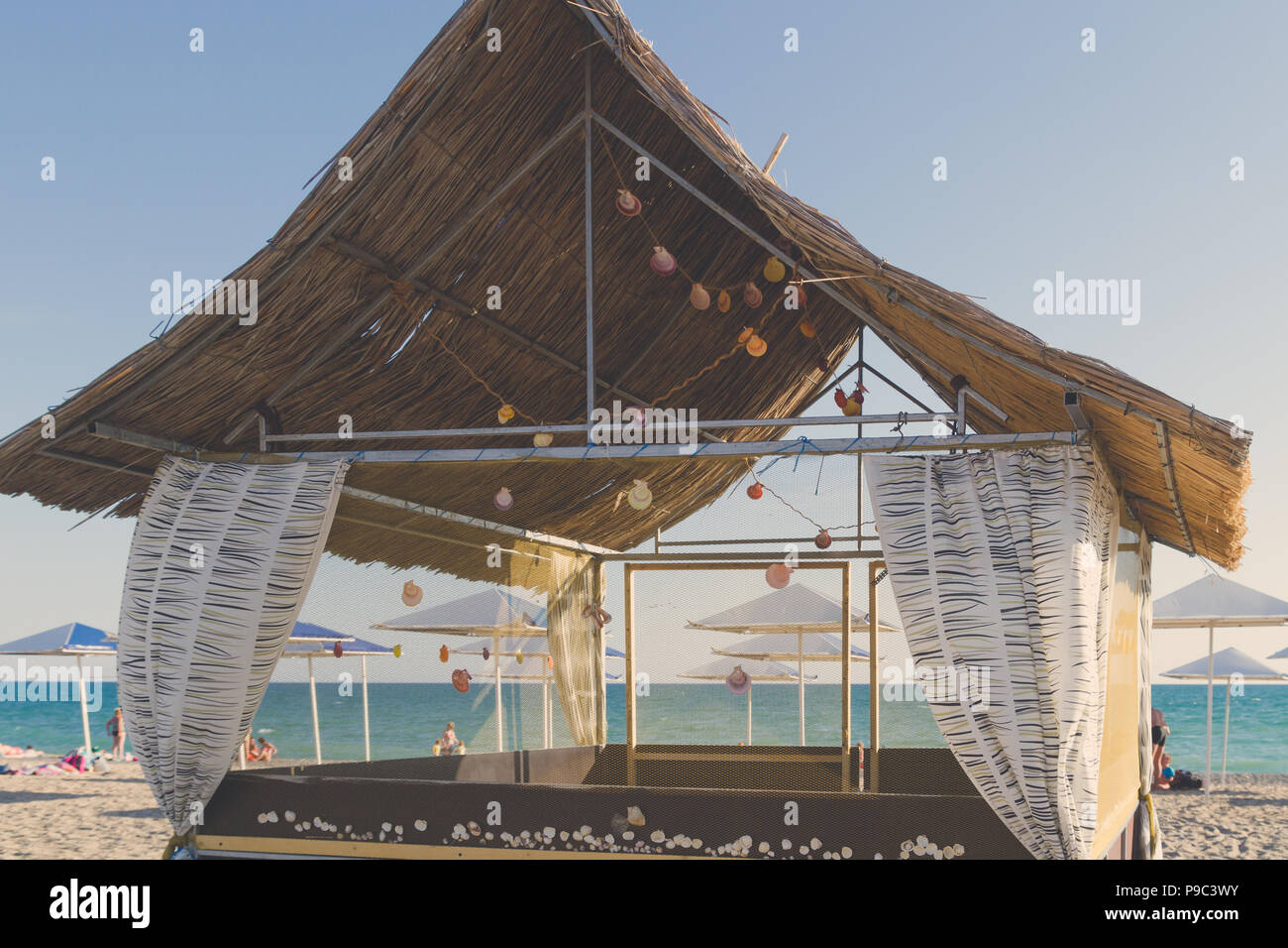 Wooden beach house decorated with sea shells on the beach Stock Photo ...