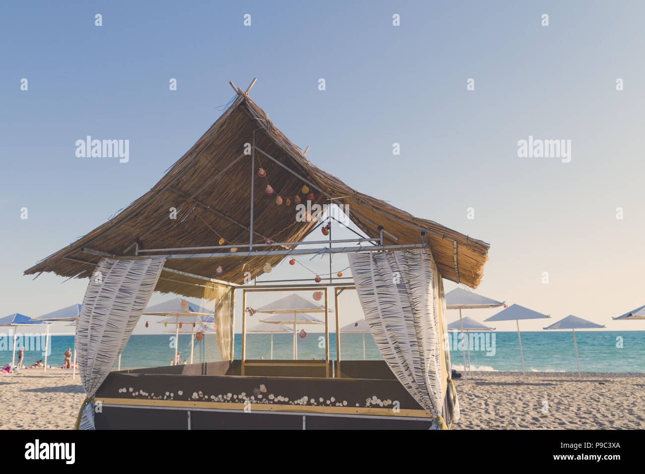 Wooden beach house decorated with sea shells on the beach Stock Photo ...