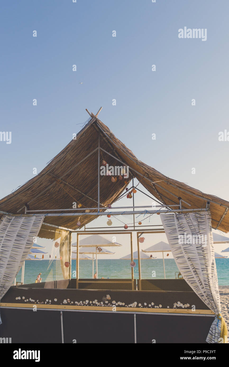 Wooden beach house decorated with sea shells on the beach Stock Photo ...