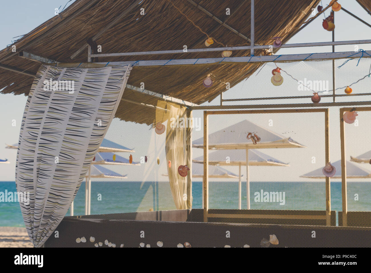 Wooden beach house decorated with sea shells on the beach Stock Photo ...