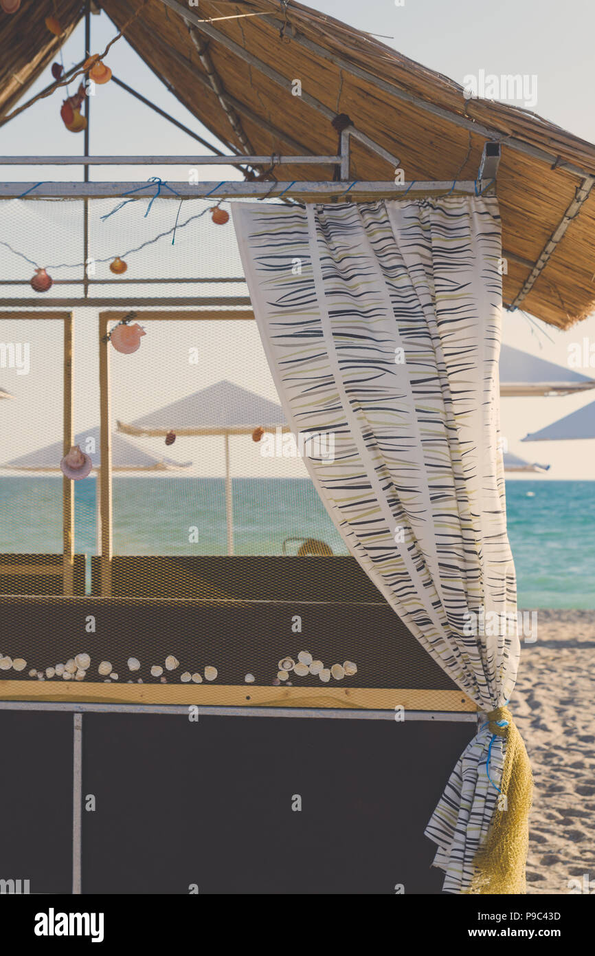 Wooden beach house decorated with sea shells on the beach Stock Photo ...