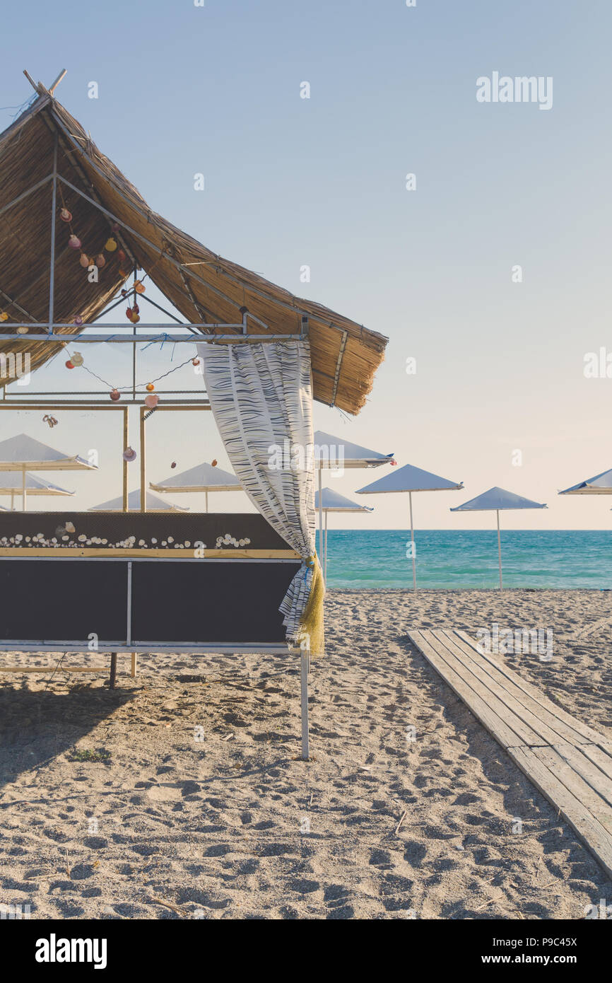 Wooden beach house decorated with sea shells on the beach Stock Photo ...