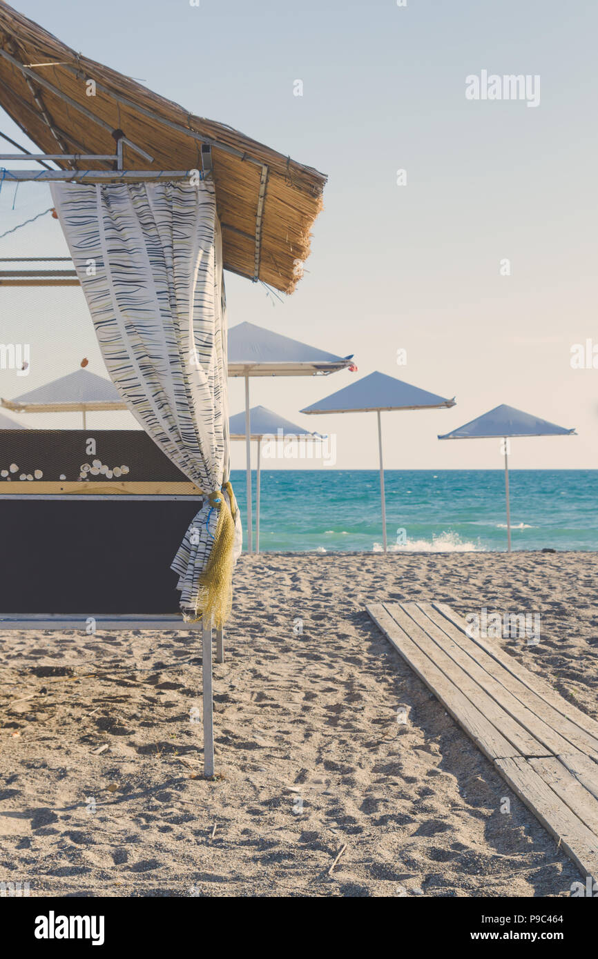 Wooden beach house decorated with sea shells on the beach Stock Photo ...