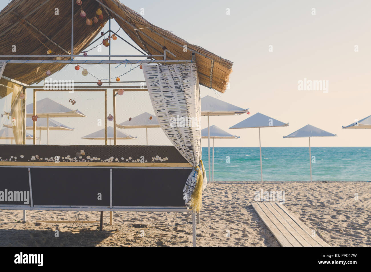 Wooden beach house decorated with sea shells on the beach Stock Photo ...