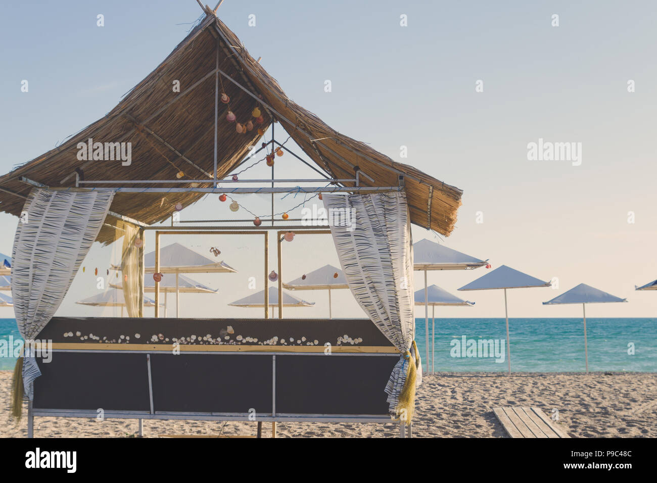 Wooden beach house decorated with sea shells on the beach Stock Photo ...