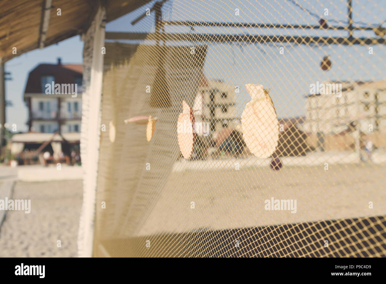 Wooden beach house decorated with sea shells on the beach Stock Photo ...
