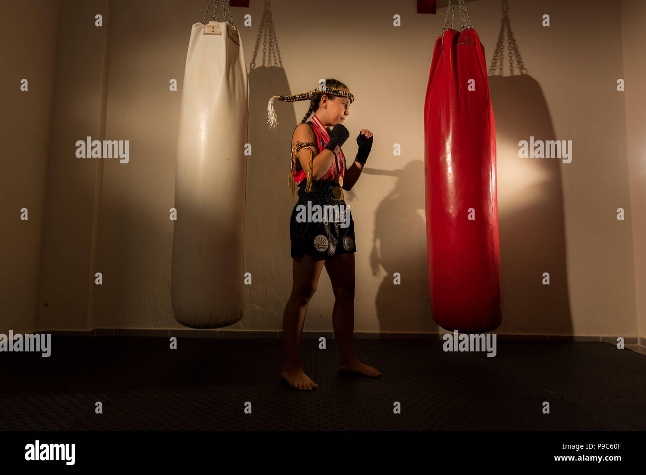 Young girl female junior kick boxer Muay Thai MMA boxing fighter Stock ...