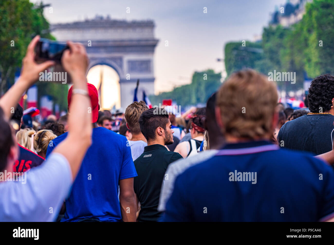 Paris, France. 15th July, 2018. Large crowds celebrate in the streets ...